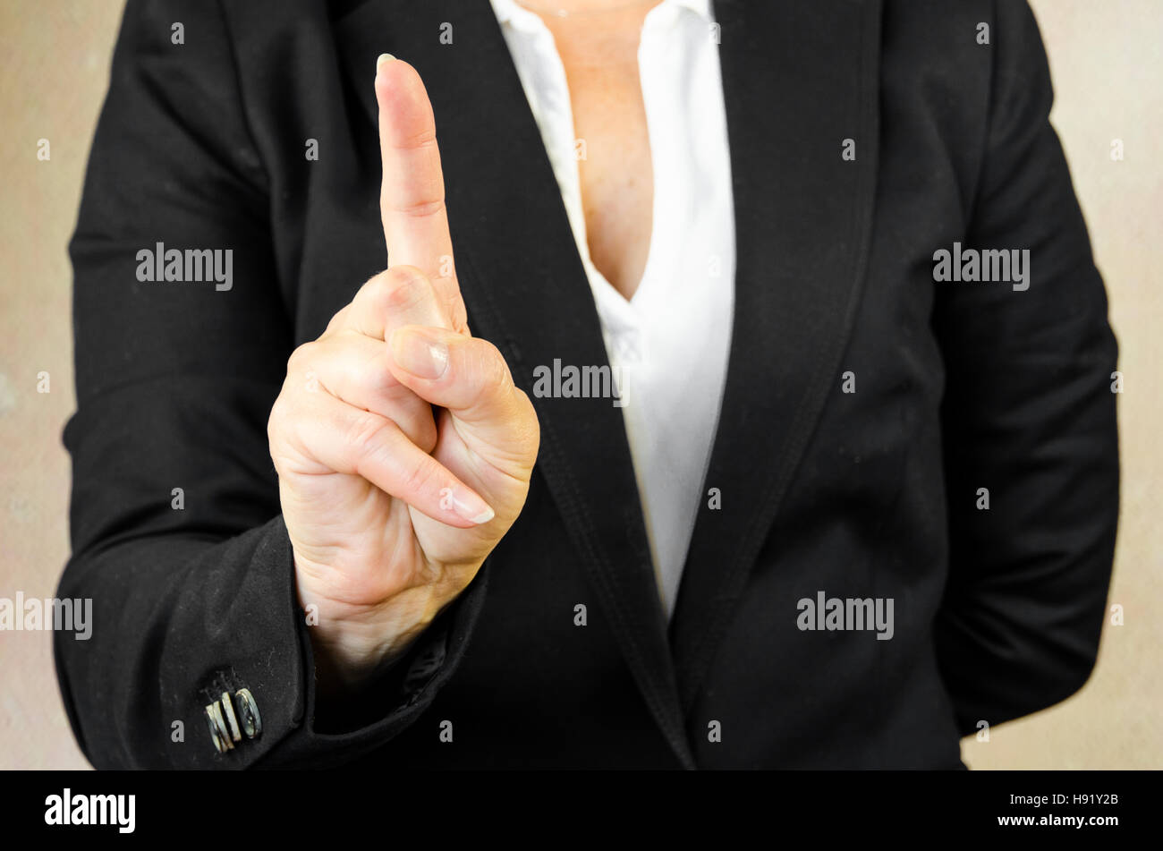gesture of hand with caution pointing finger Stock Photo - Alamy