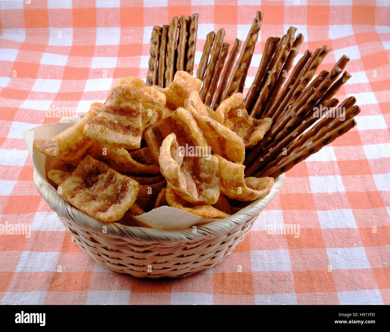 Basket to beer with chips and salty grain sticks Stock Photo - Alamy
