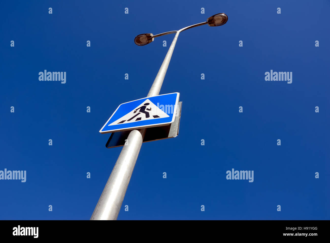 Guide sign, column of illumination against the dark blue sky Stock ...