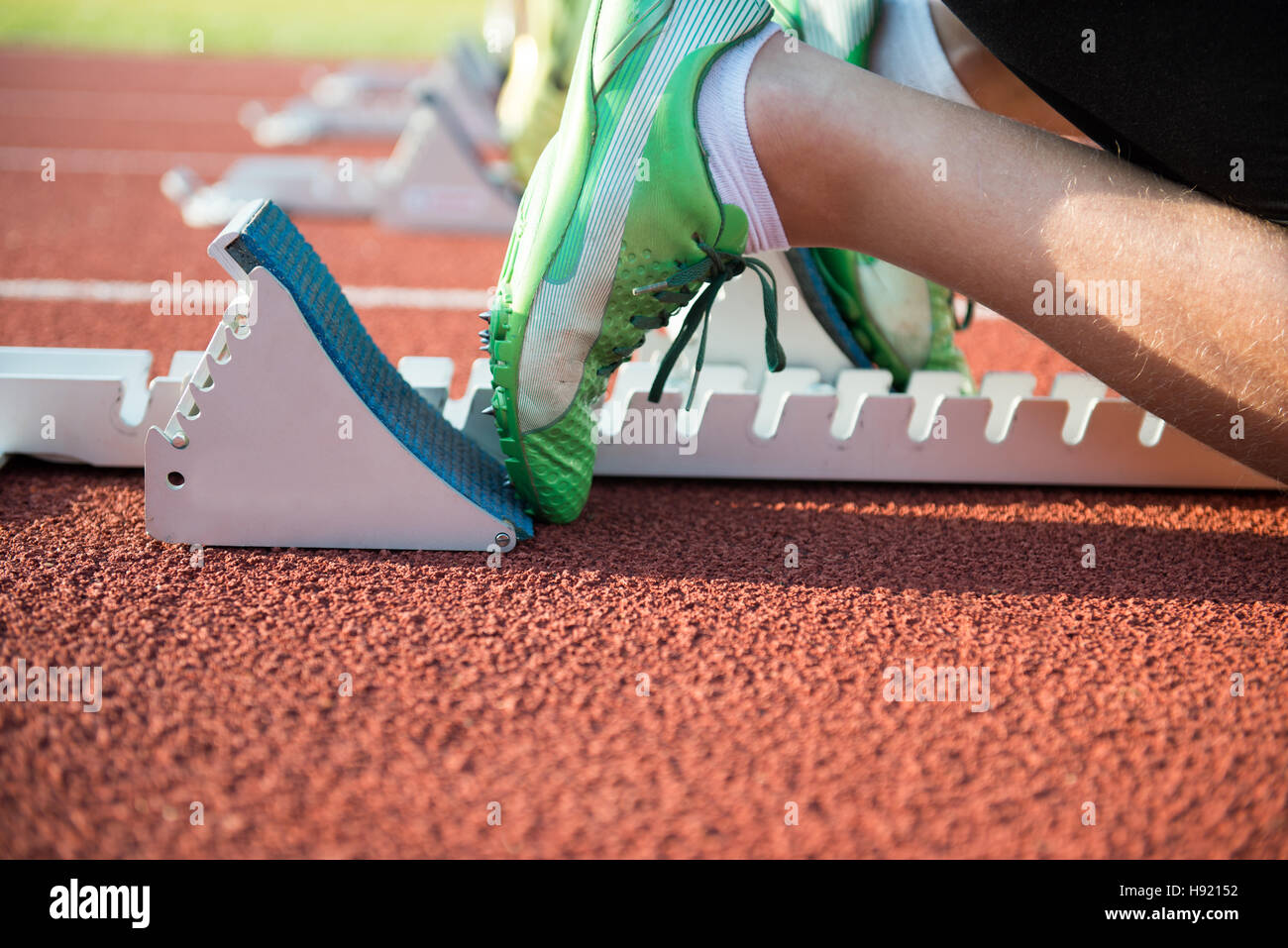 Close-up of sprinter feet in starting block Stock Photo - Alamy