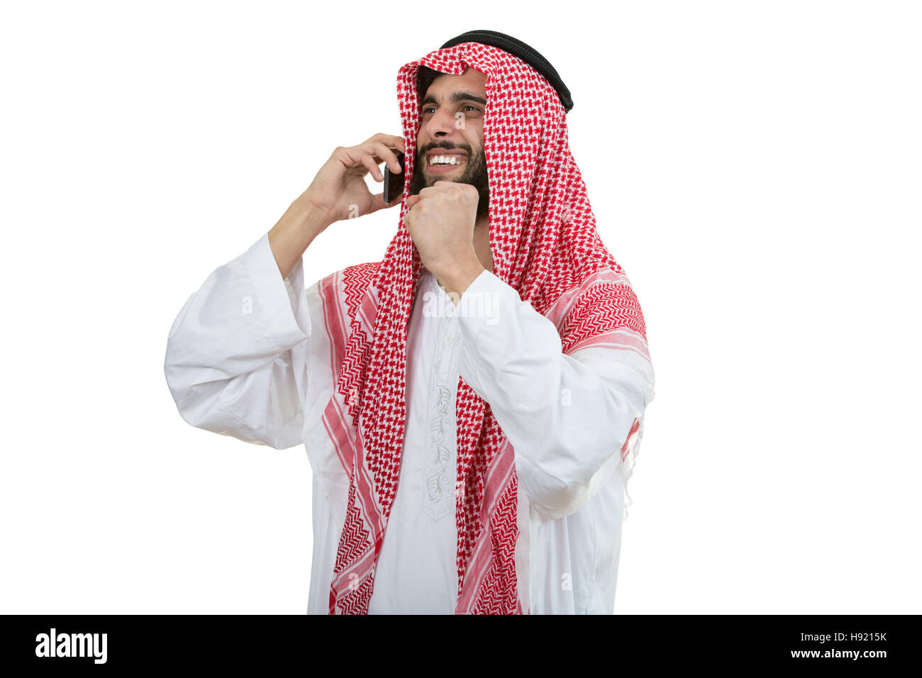 Side view of an arab saudi emirates man using a smart phone Stock Photo ...