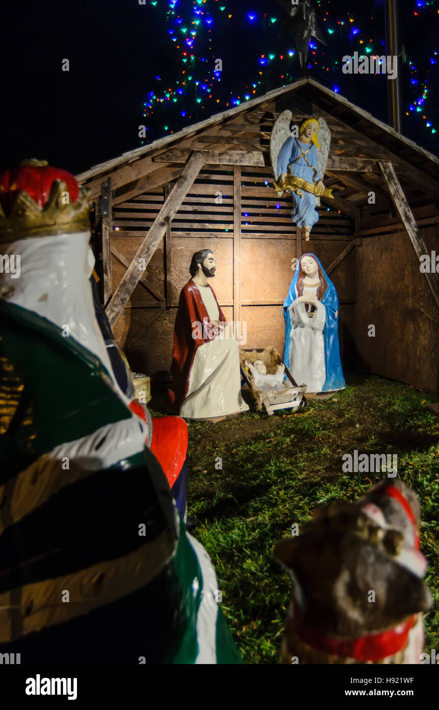 Christmas display of Holy family in traditional outdoor nativity ...