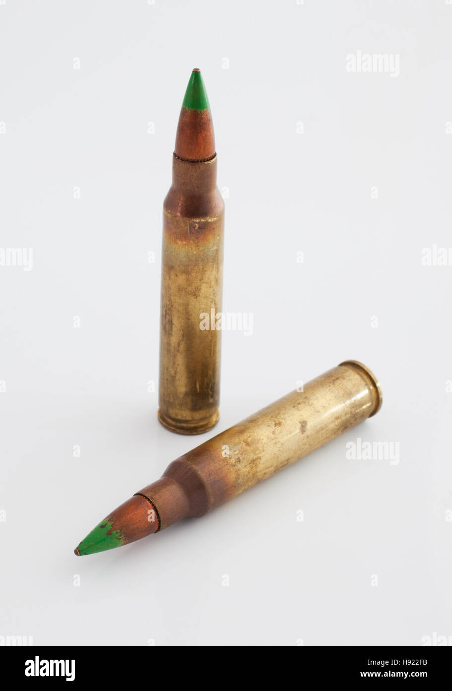 Rifle cartridges with bullets that have a green tip Stock Photo - Alamy