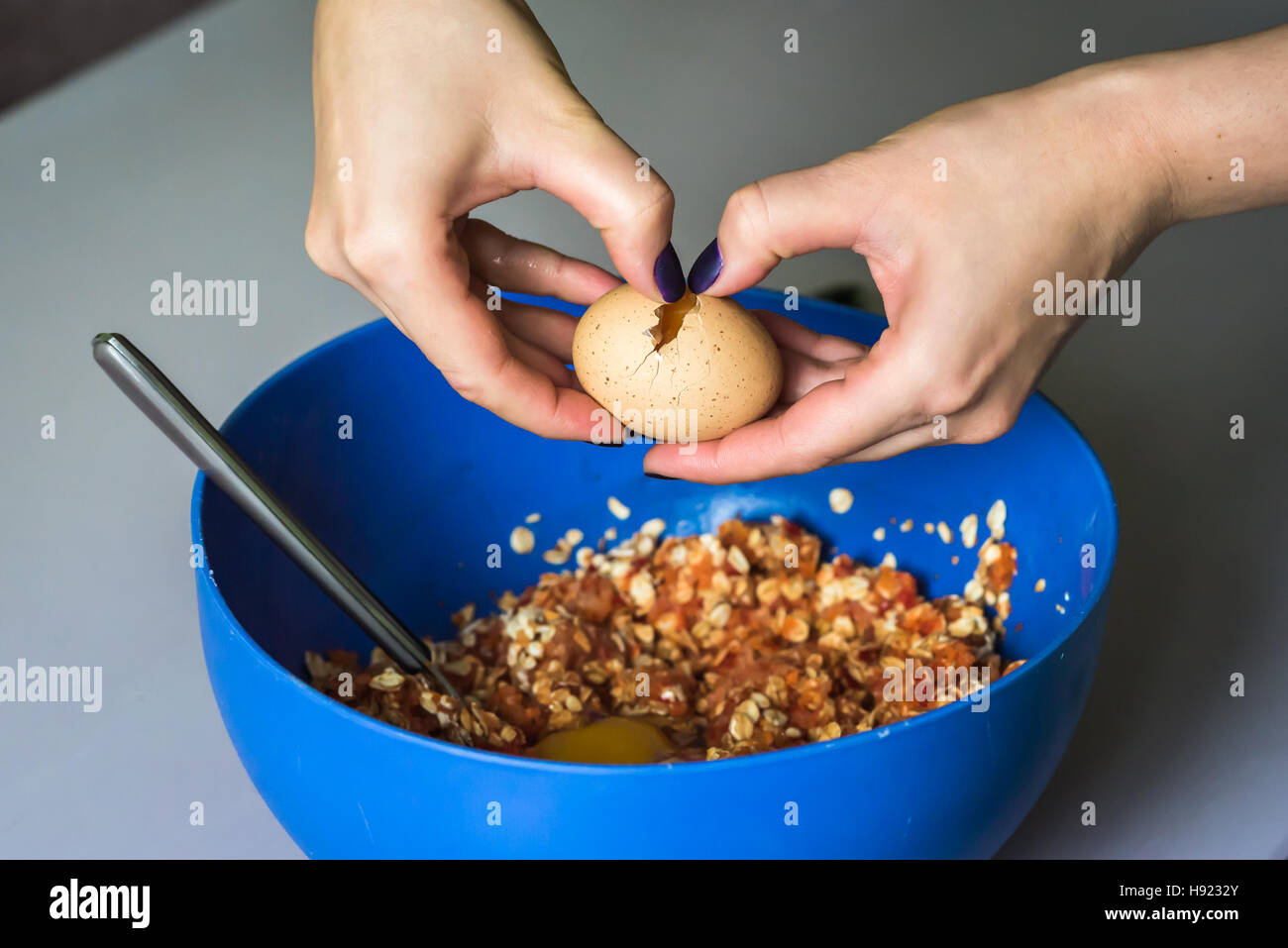 Professional chef pouring raw egg hi-res stock photography and images ...