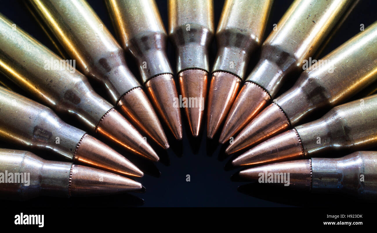 Rifle ammunition with bullets that have steel inside on a black ...