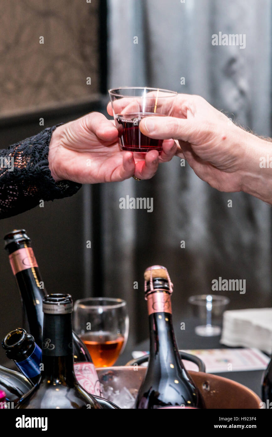 Hands with Sample of Red Wine Stock Photo - Alamy