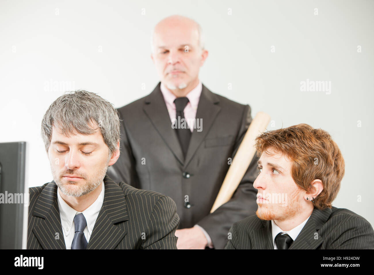 stern boss controls office workers from behind their backs ready to ...