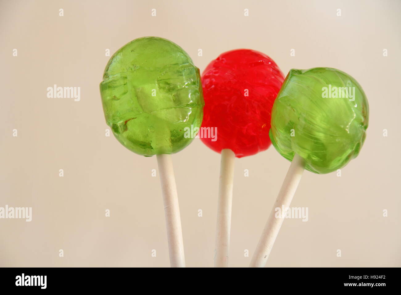 Three lollipops isolated on a clear white background image with copy ...