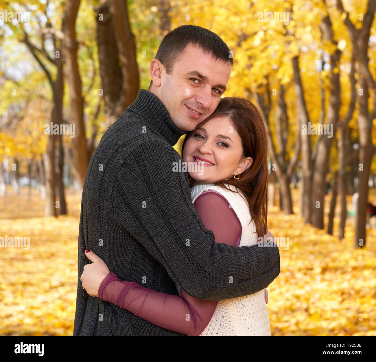romantic people, happy adult couple embrace in aut Stock Photo - Alamy