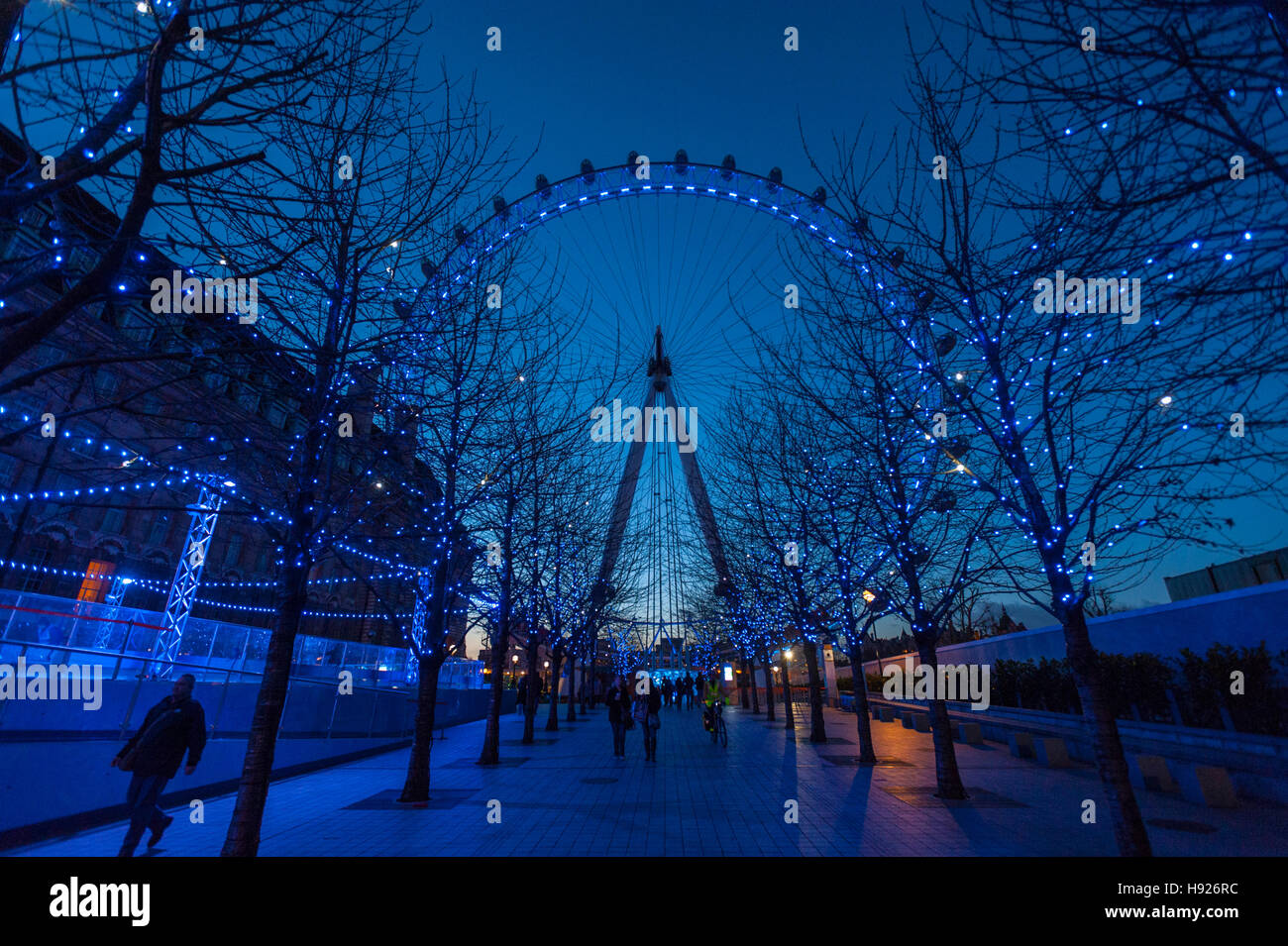 The london eye from the south at dusk with the eye lit by blue lights ...