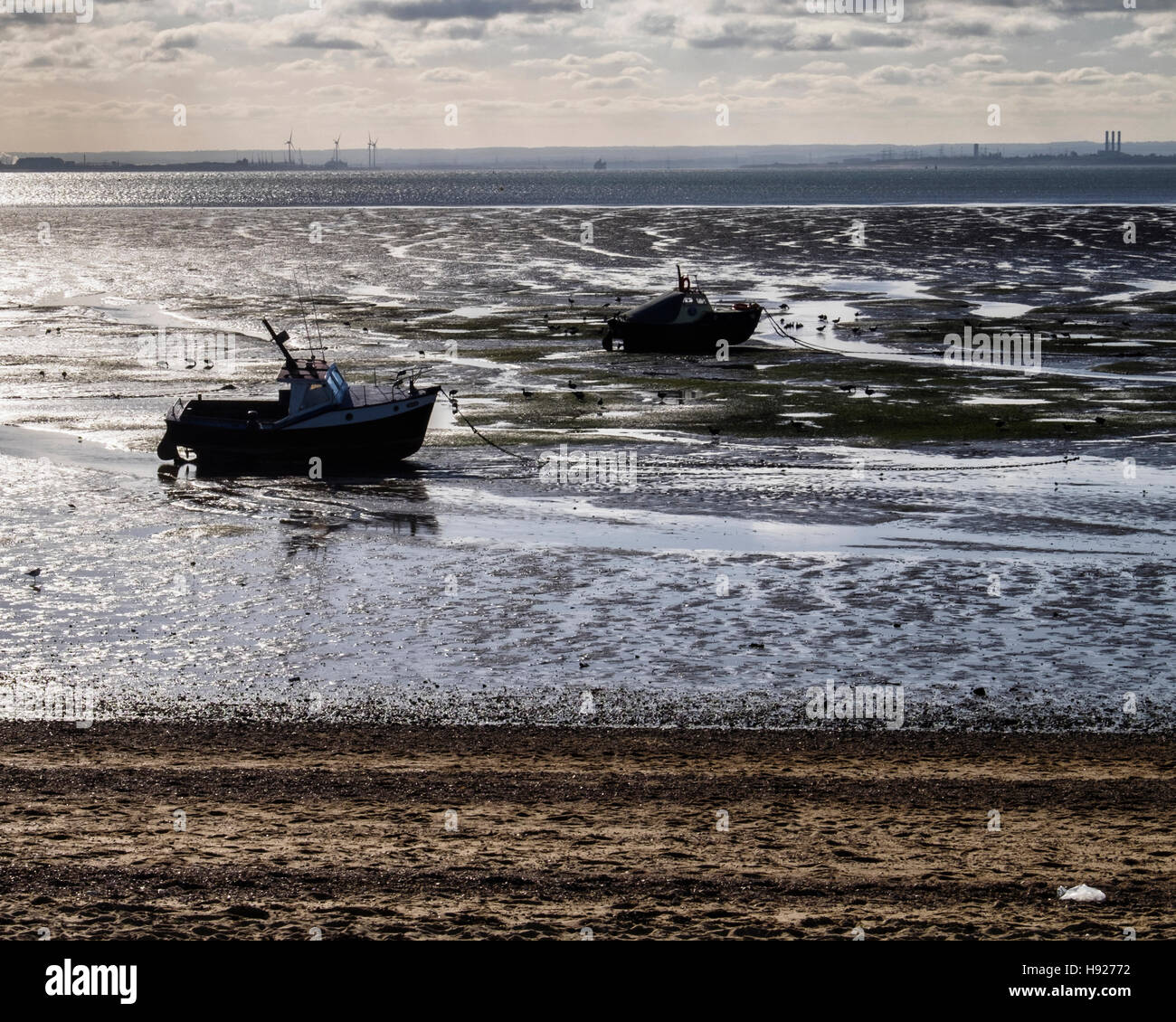 Beached boats. At low tide the tide is out on the tidal riverbed of the ...