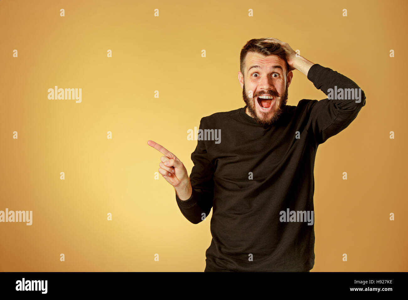 Portrait of young man with shocked facial expression Stock Photo - Alamy