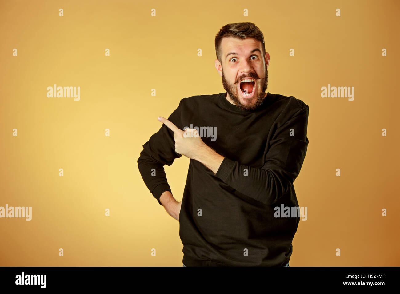 Portrait of young man with shocked facial expression Stock Photo - Alamy