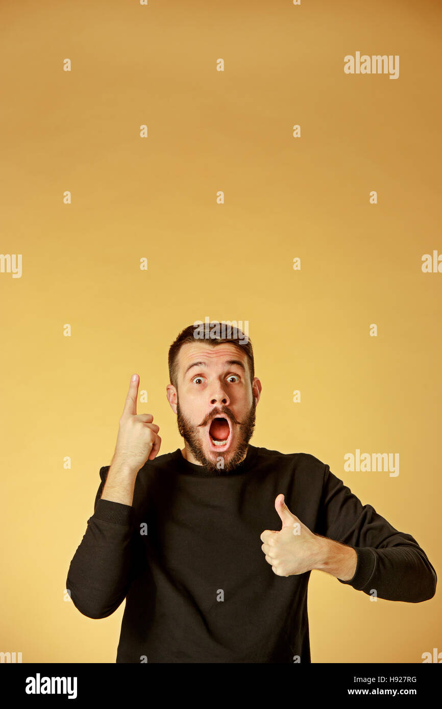 Portrait of young man with shocked facial expression Stock Photo - Alamy