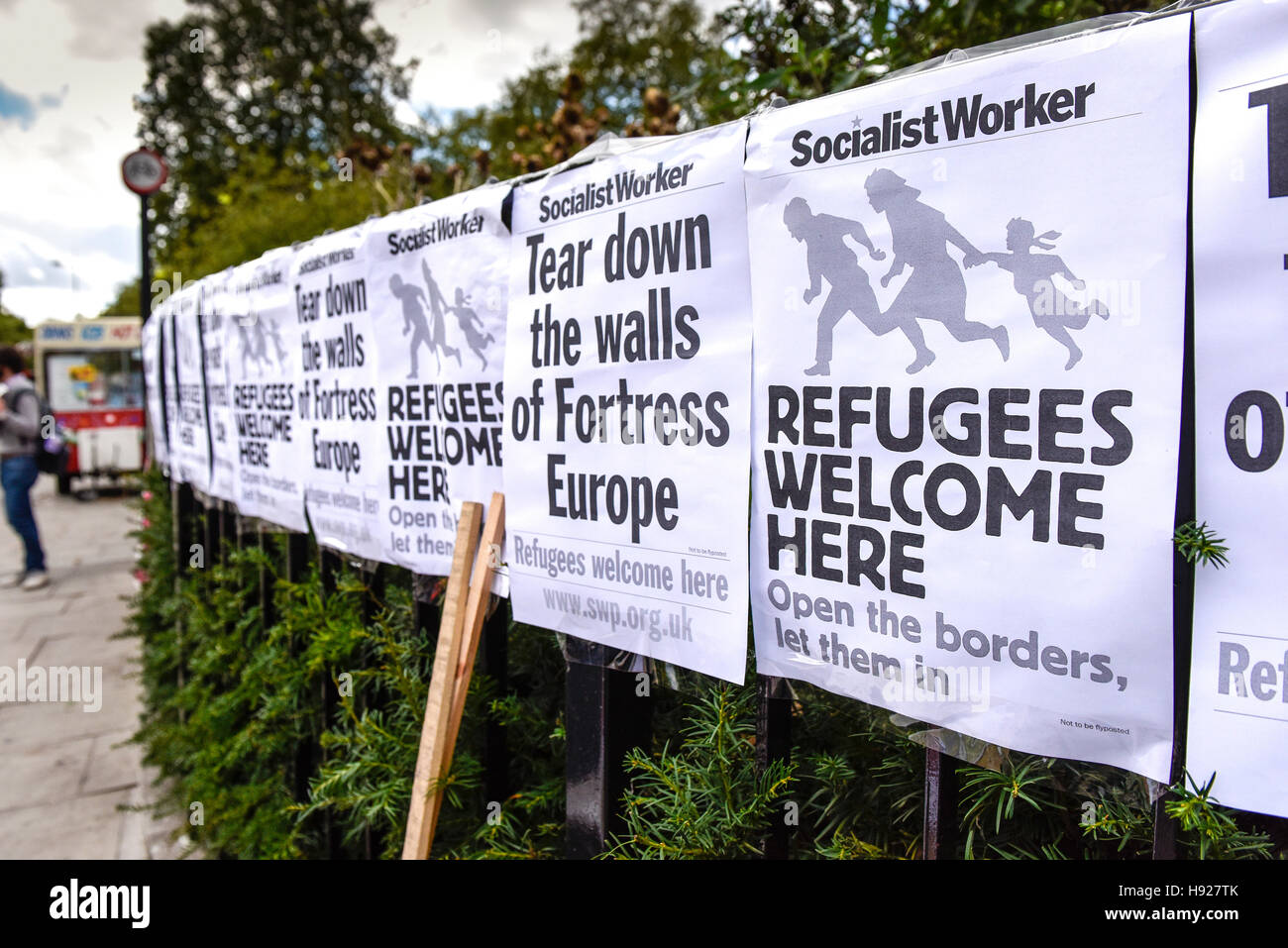 Posters used during a demonstration in support of refugees and migrants ...