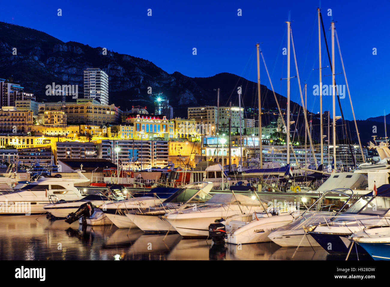 Marina yachts and downtown at night Stock Photo - Alamy