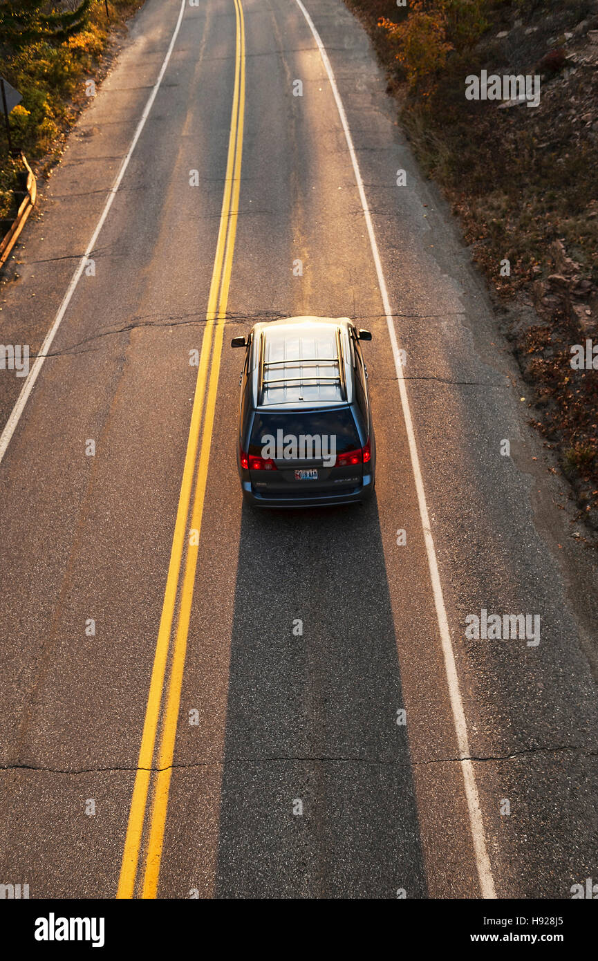 Car traveling along a road at sunset Stock Photo - Alamy