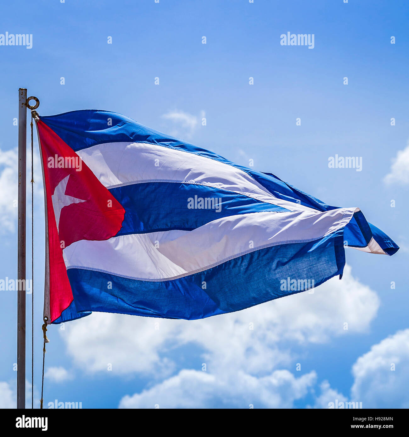 The national flag of Cuba captured flapping in the warm Caribbean ...