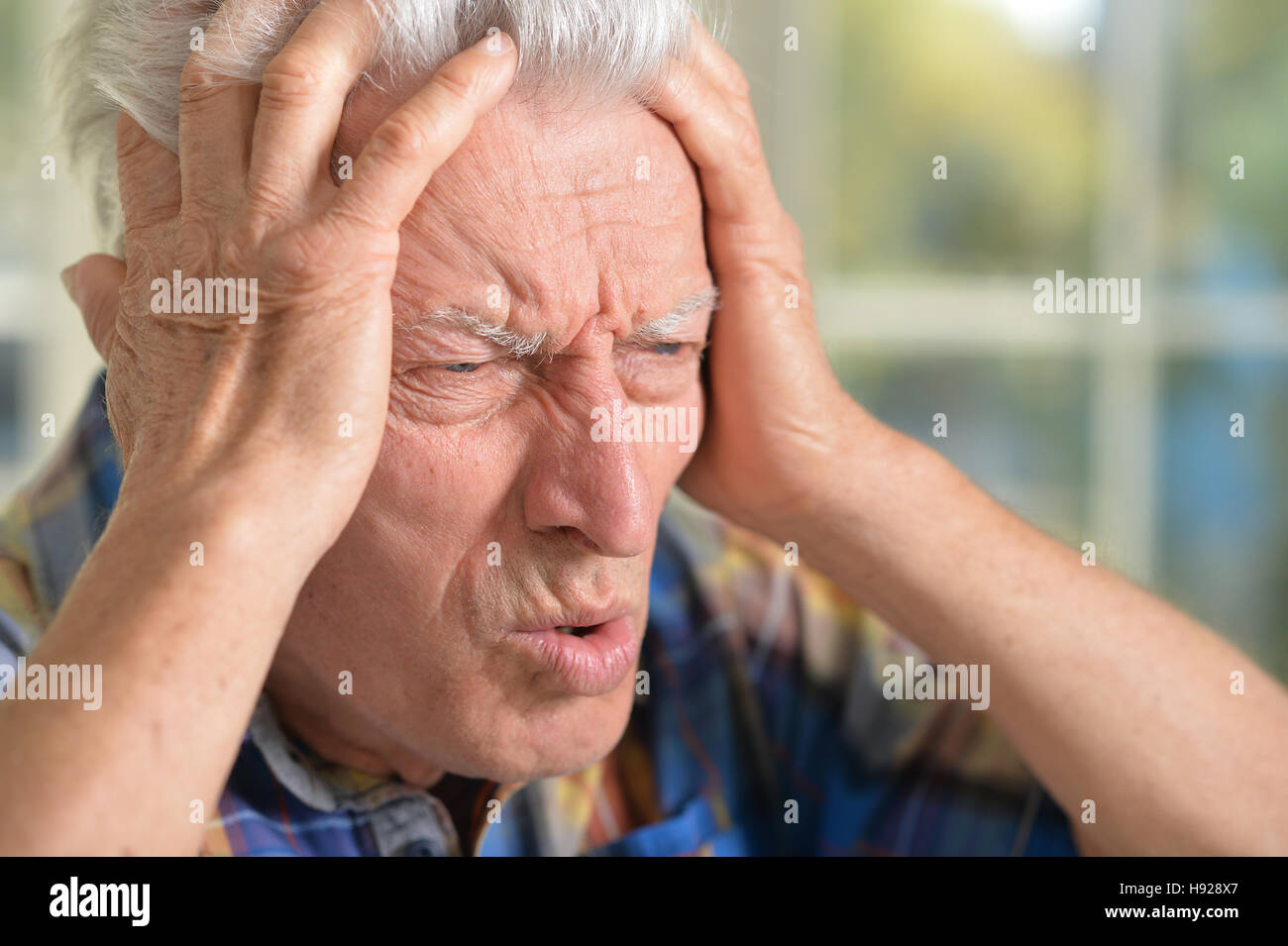 Stressed senior man Stock Photo - Alamy