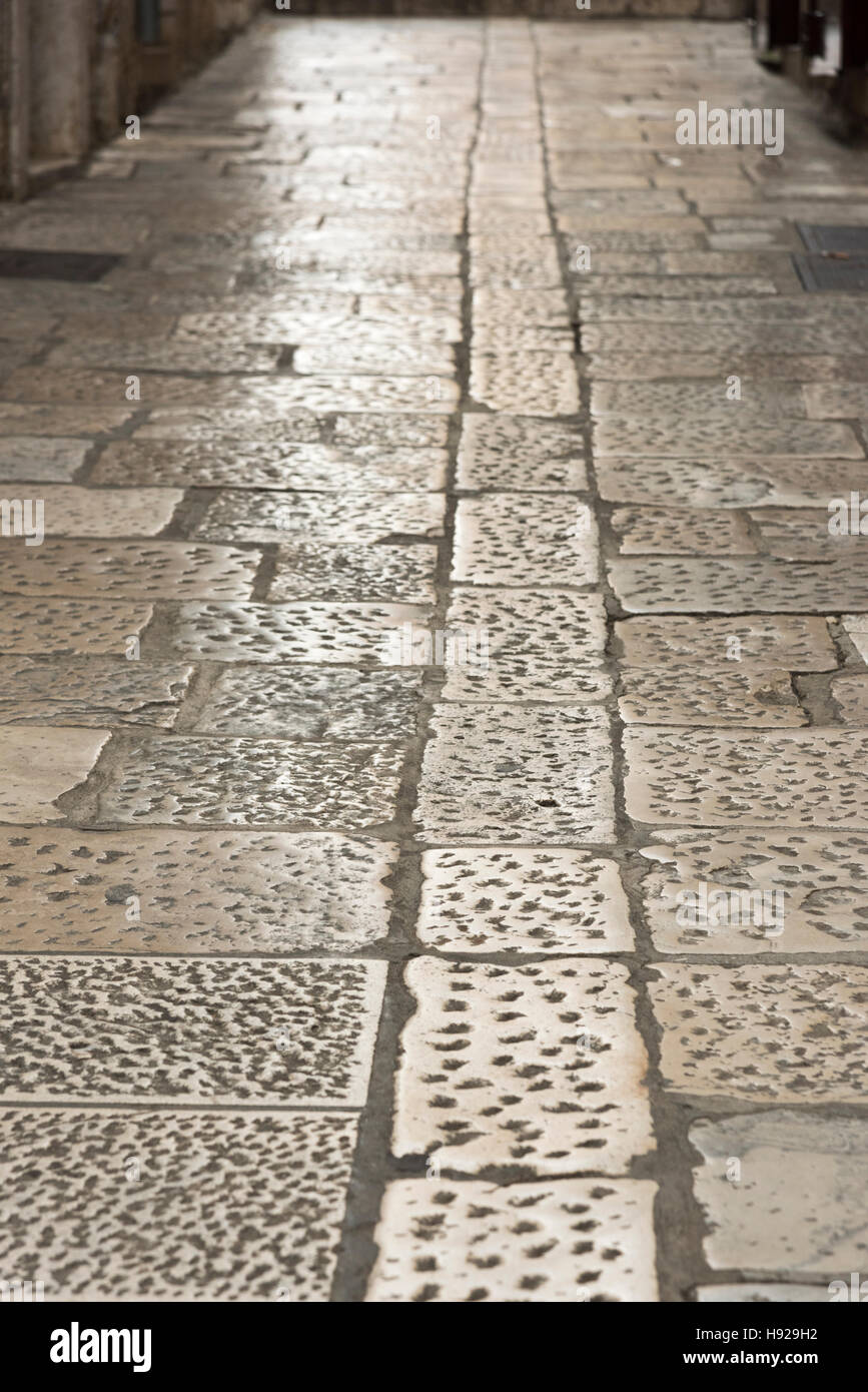 A close up of ancient marble pavement and street in Korcula Croatia ...