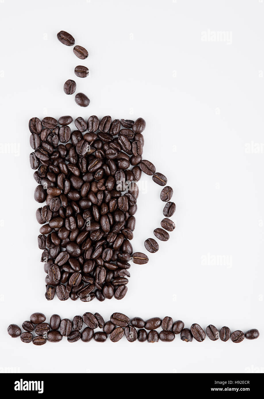 Cup of black coffee shape created from beans Stock Photo - Alamy