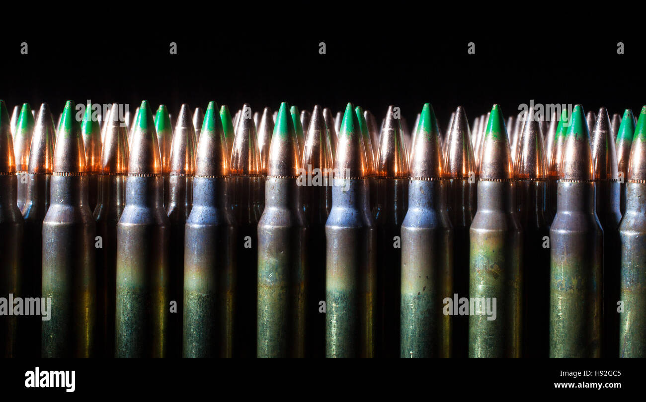 Cartridges with some of them having green tips on the bullets Stock ...