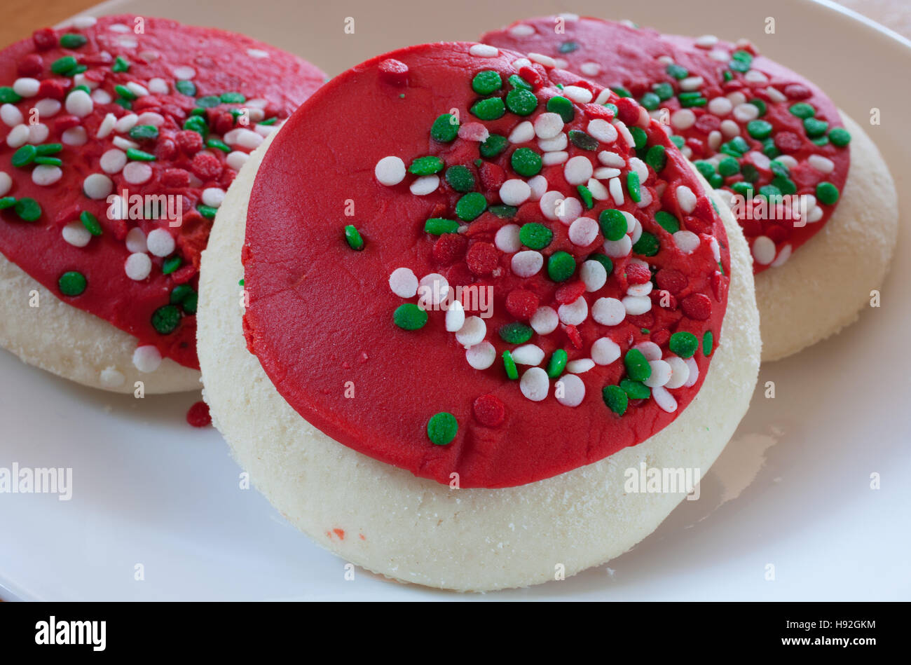 Bright cookies with red frosting and green and white sprinkles Stock ...