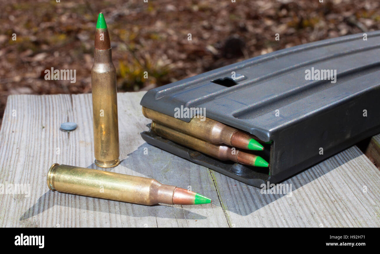 Rifle cartridges with a green tip and loaded magazine Stock Photo - Alamy