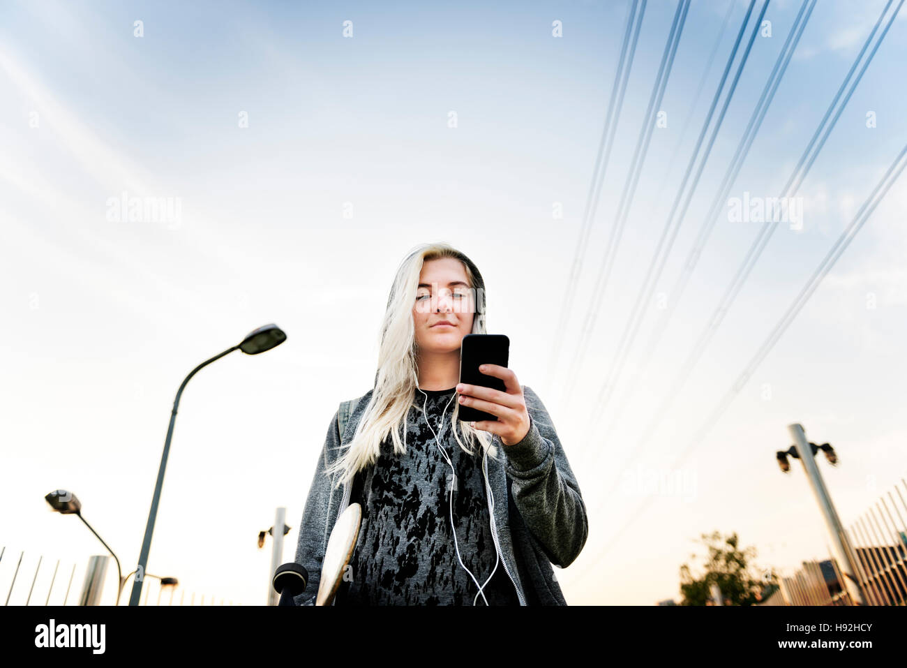 Young Woman Skater Browsing Phone Concept Stock Photo - Alamy