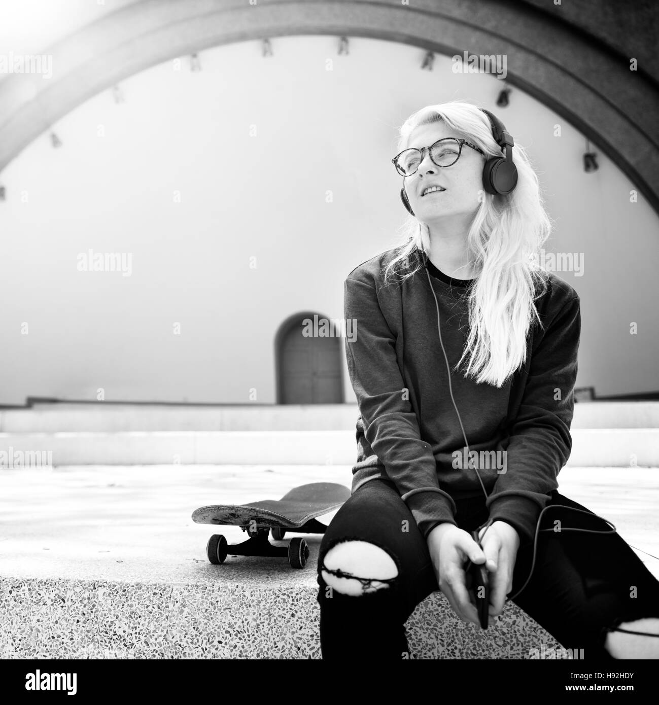 Young Woman Skater Listening Music Concept Stock Photo - Alamy
