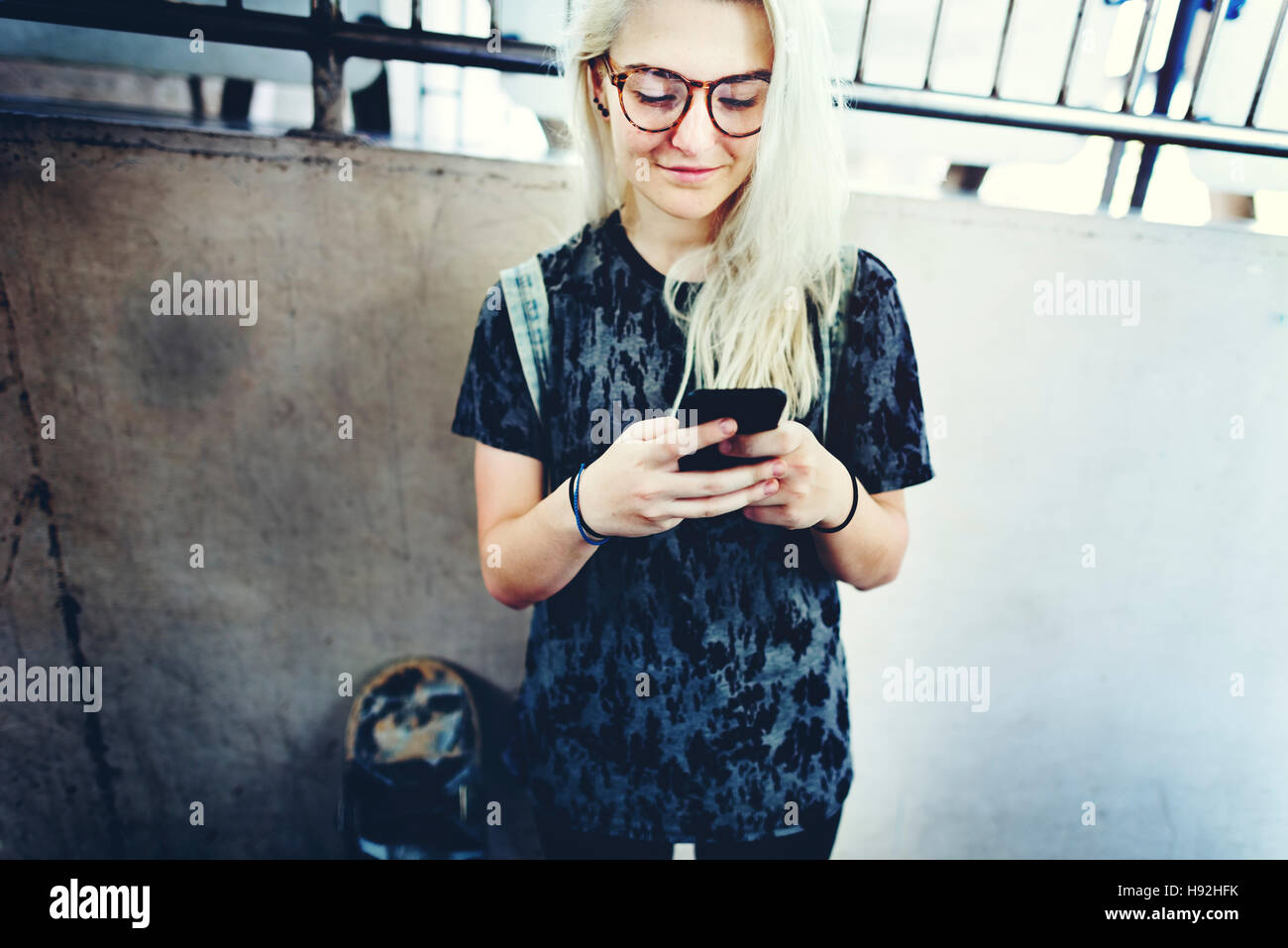 Young Woman Skater Browsing Phone Concept Stock Photo - Alamy