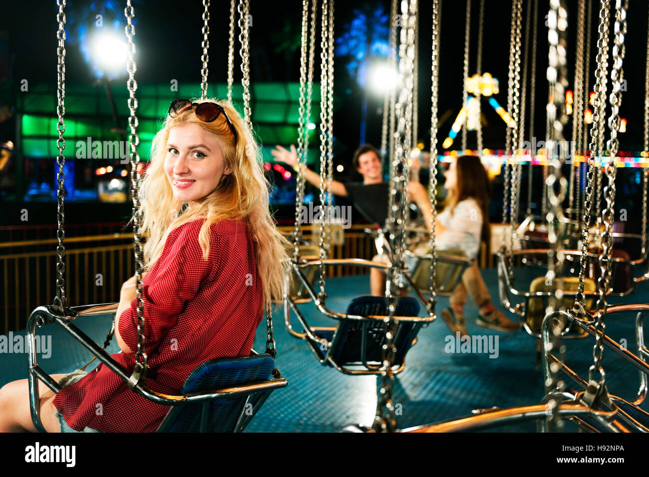 Woman Carnival Ride Riding Happiness Fun Concept Stock Photo - Alamy