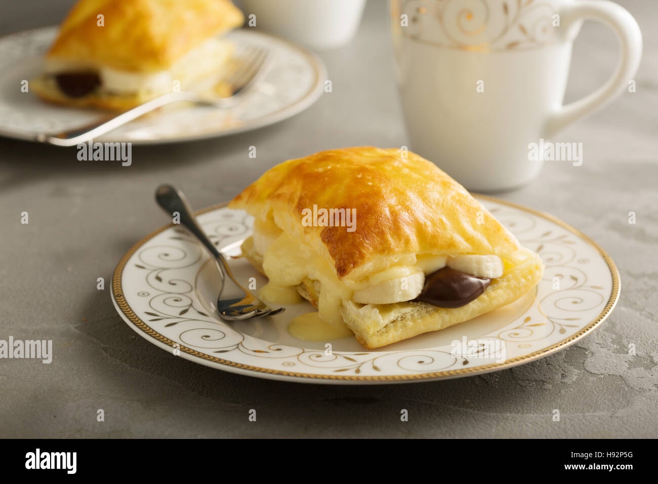 Puff pastry stacks with banana and chocolate Stock Photo - Alamy