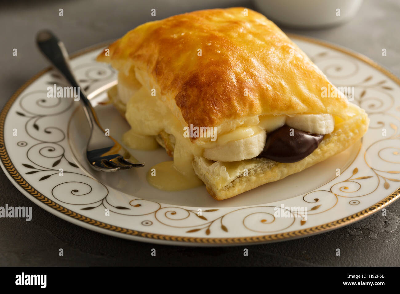 Puff pastry stacks with banana and chocolate Stock Photo - Alamy