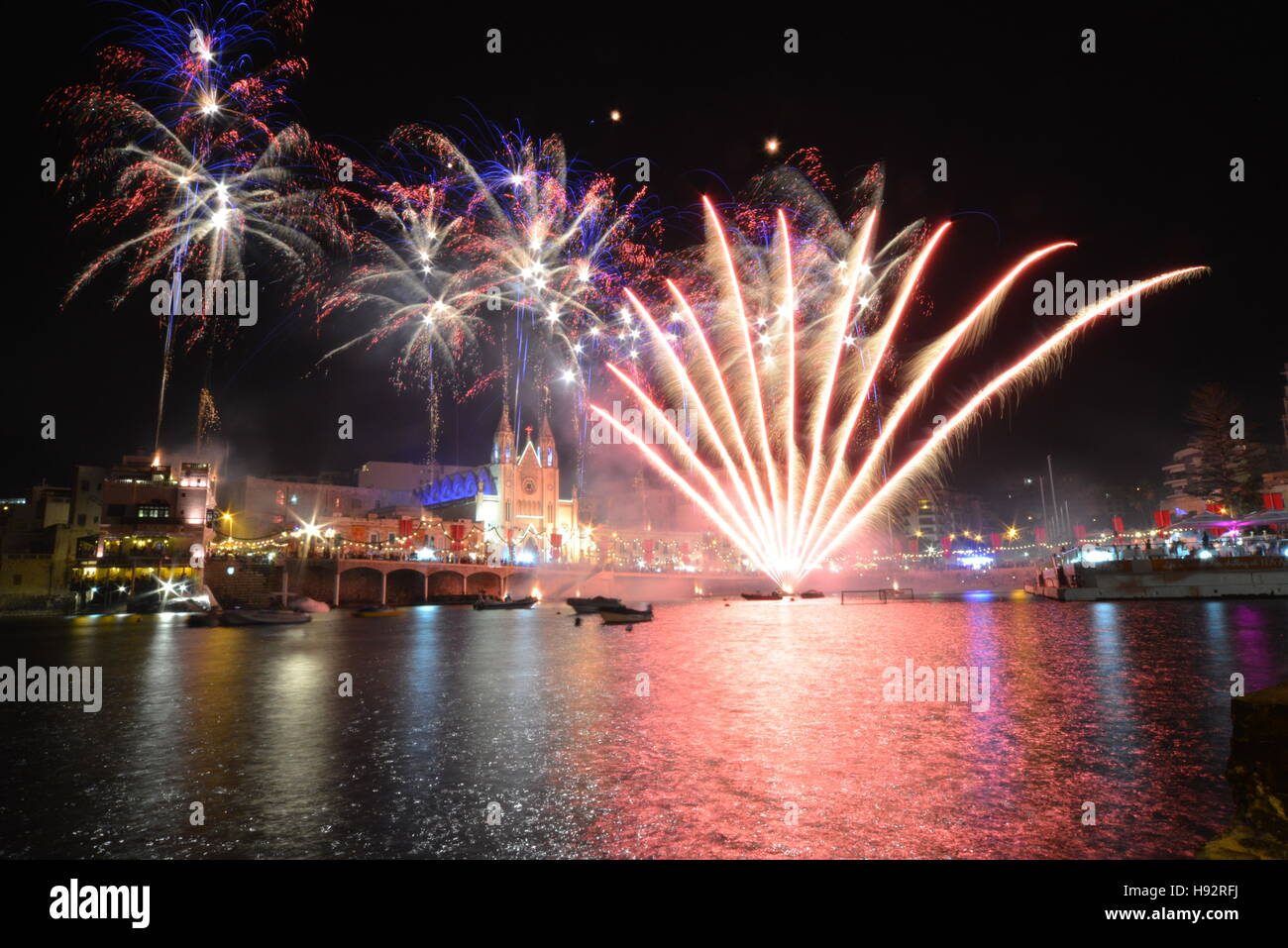 Summer evenings in Malta: fireworks display in Balluta Stock Photo - Alamy