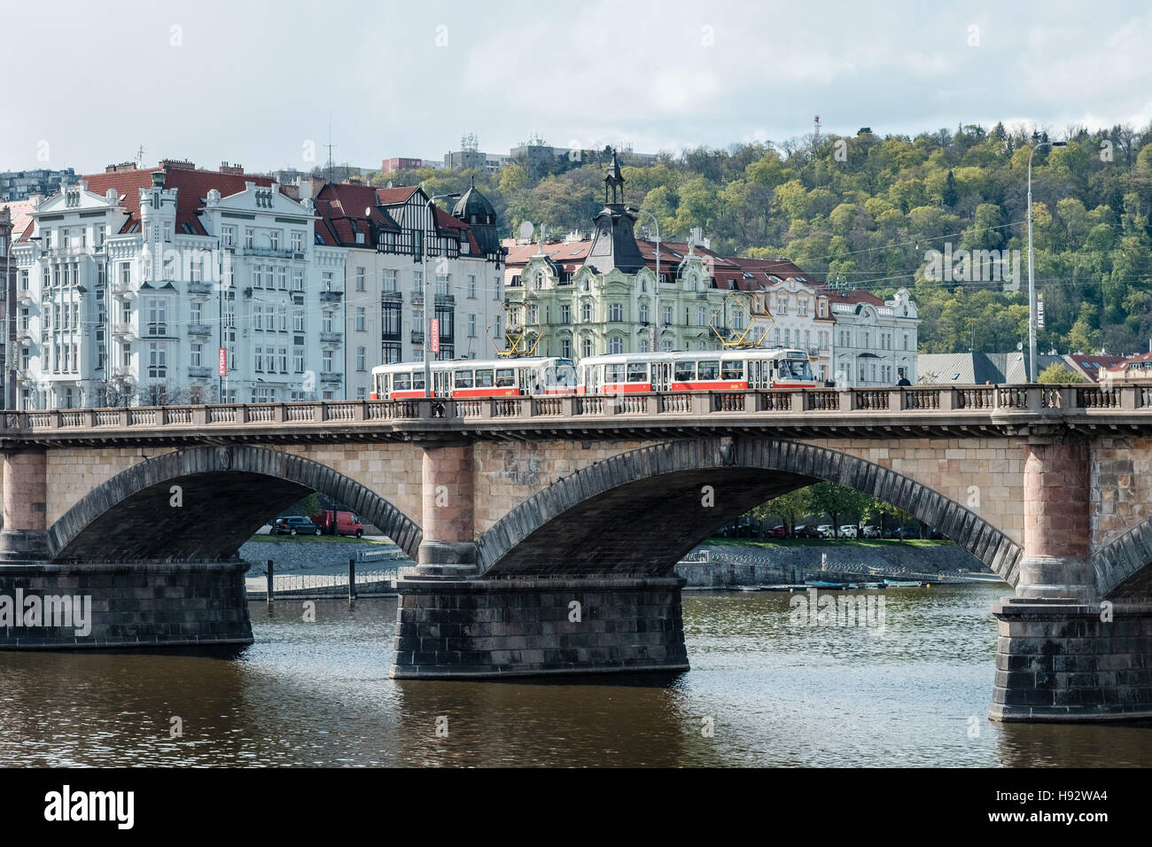 Tram crossing the Palacký Bridge over the river Vltava in central ...