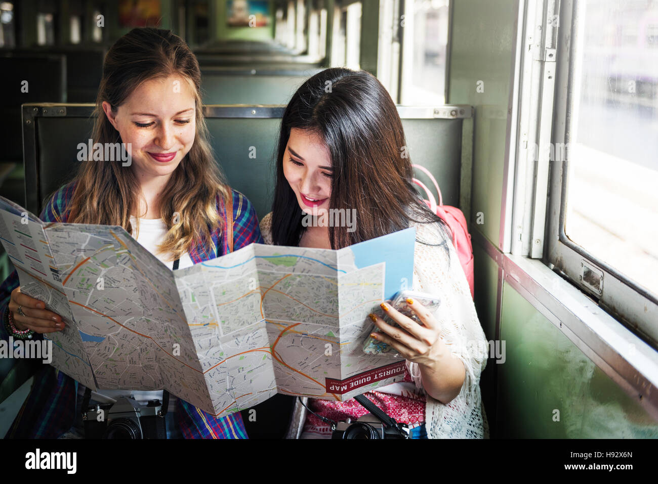 Girls Friendship Hangout Traveling Holiday Map Concept Stock Photo - Alamy