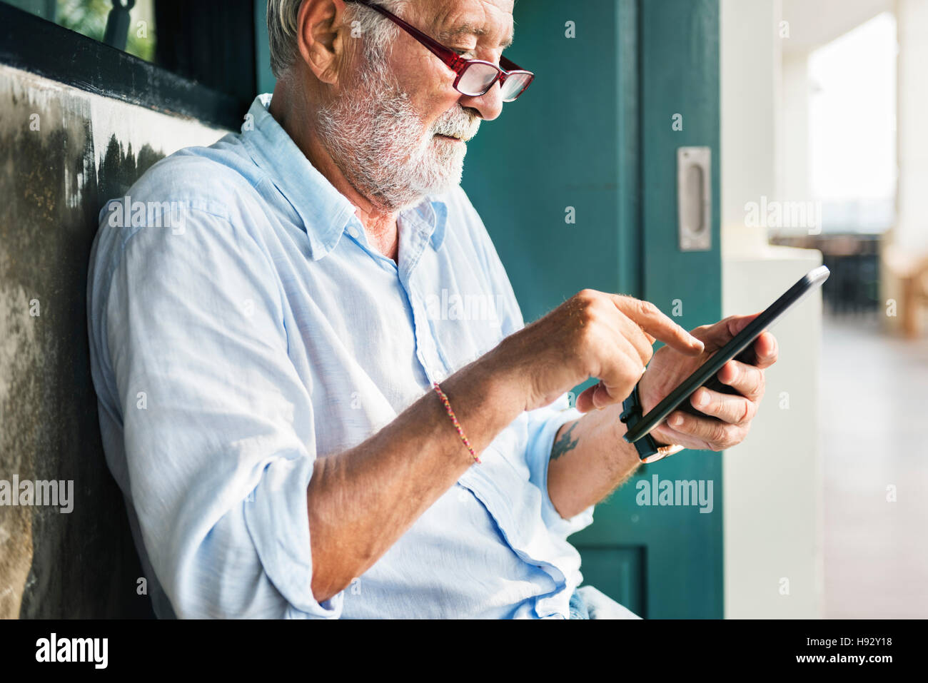 Old Man Using Telephonne Online Concept Stock Photo - Alamy