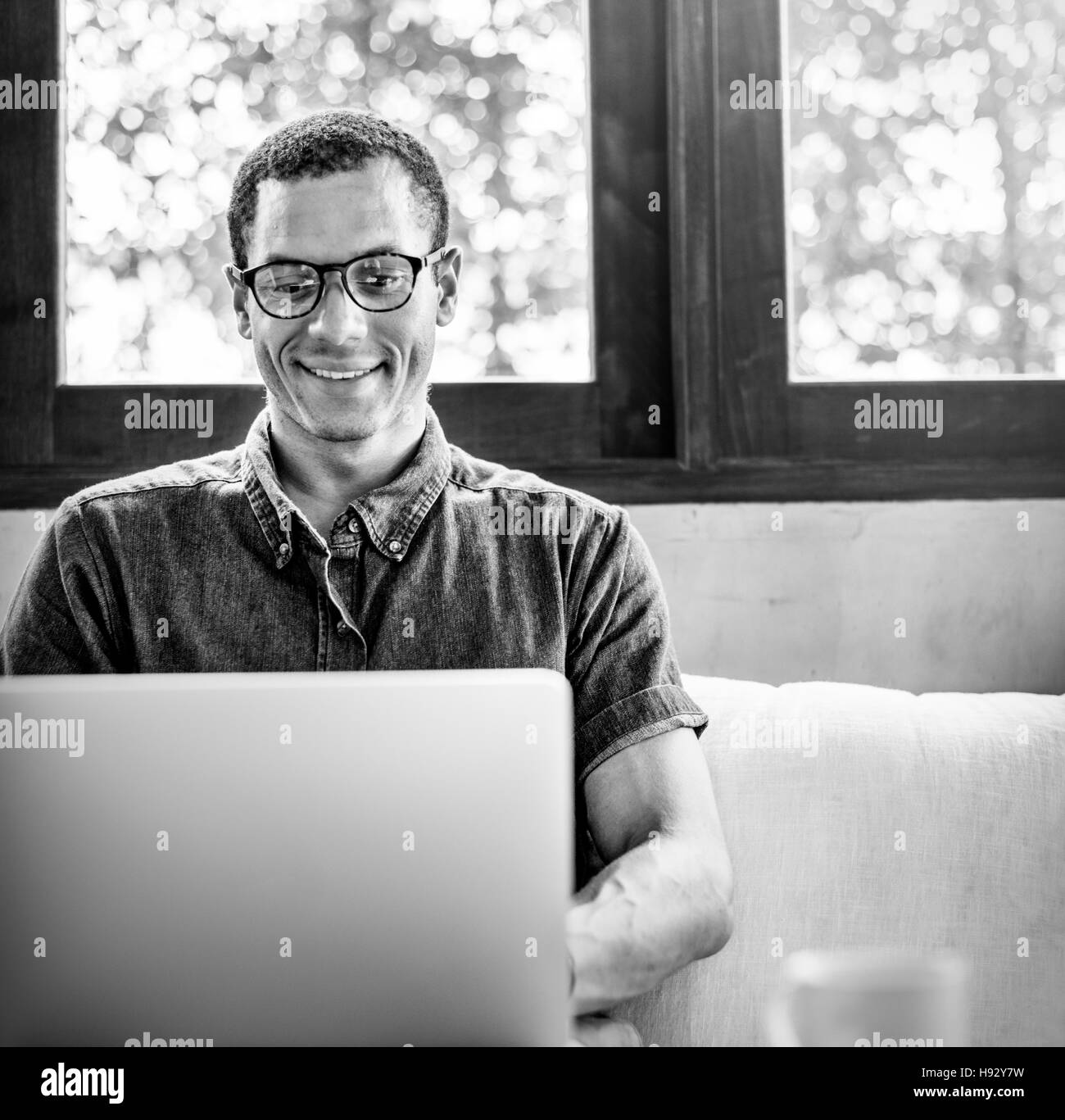 Man working using laptop at home Black and White Stock Photos & Images ...