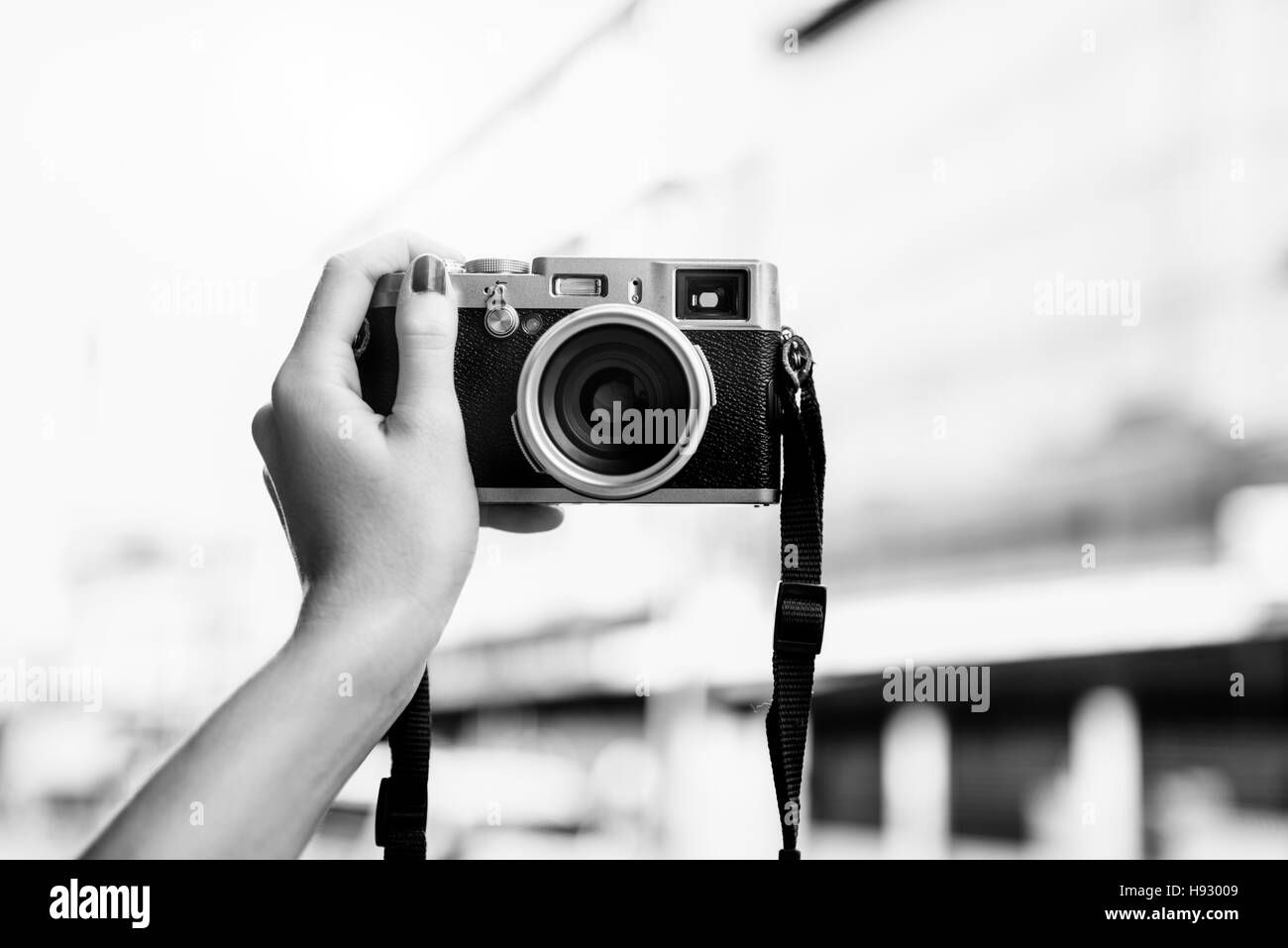 Photography camera holding Black and White Stock Photos & Images - Alamy