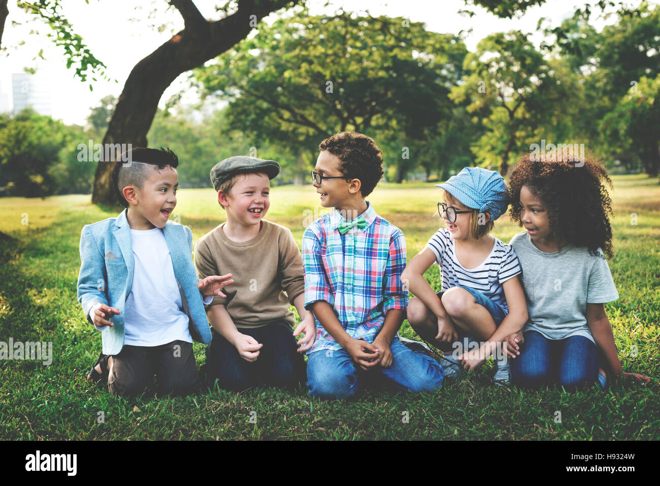 Kids Playing Cheerful Park Outdoors Concept Stock Photo - Alamy