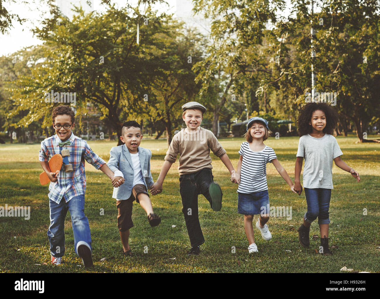 Kids Huddle Happiness Fun Smiling Concept Stock Photo - Alamy