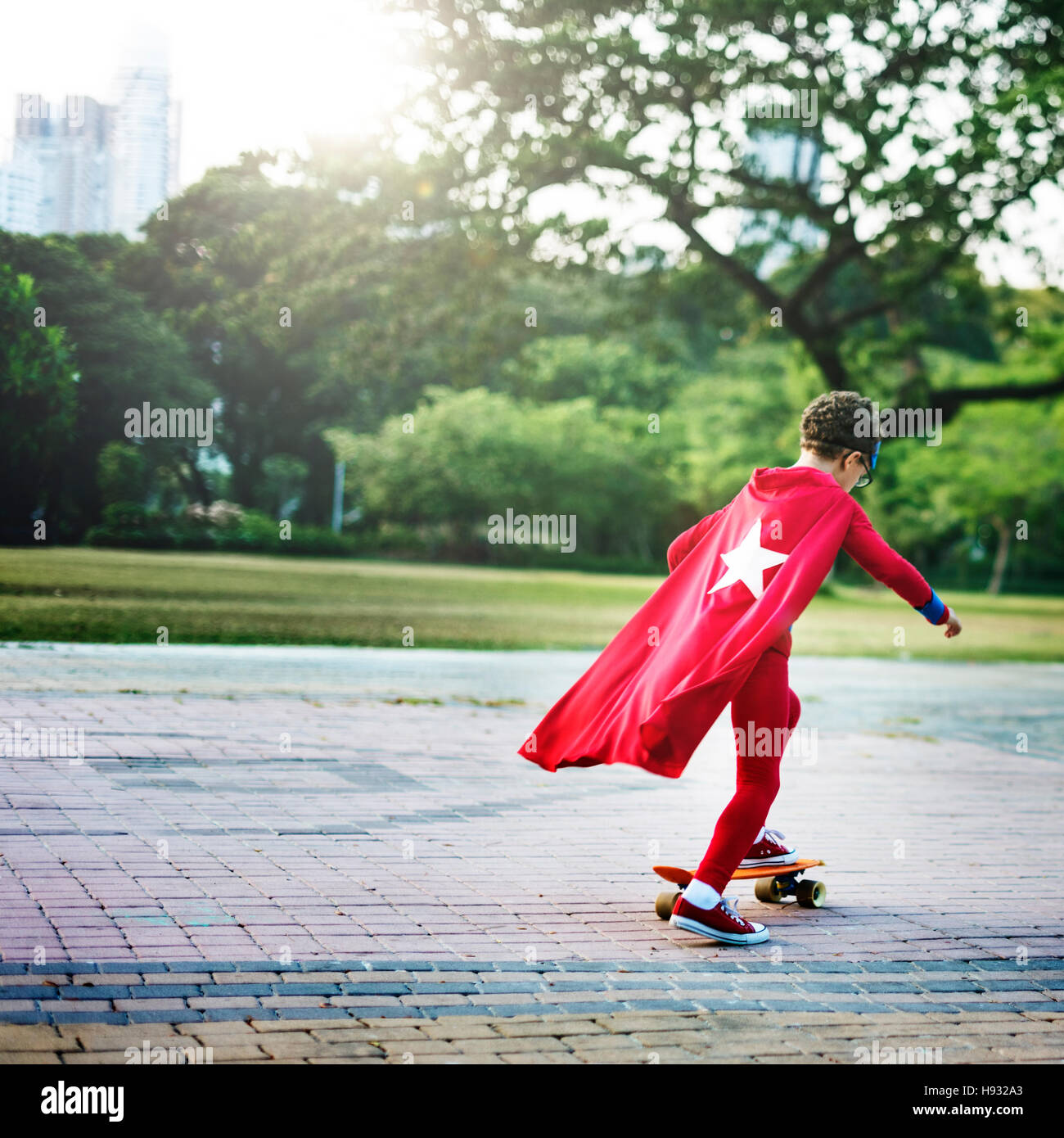 Kid Skateboard Superhero Youth Playful Concept Stock Photo - Alamy