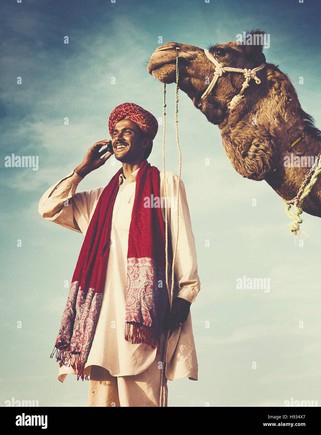 Indian Man On the Phone Camel Communication Concept Stock Photo - Alamy