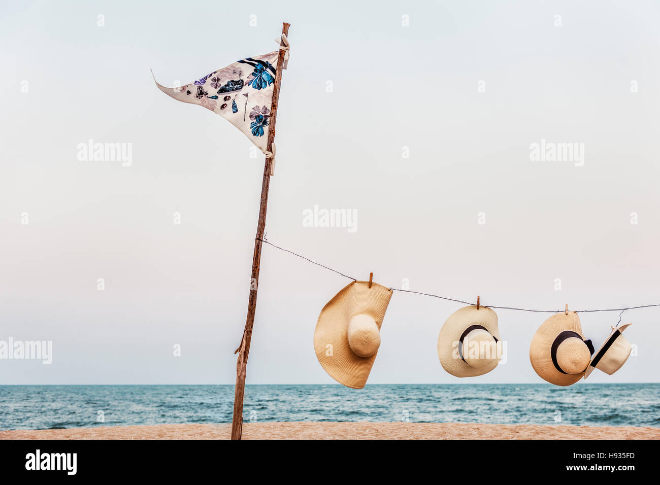 Hanging Peg Woven Hats Flag Pole Sea Shore Concept Stock Photo - Alamy