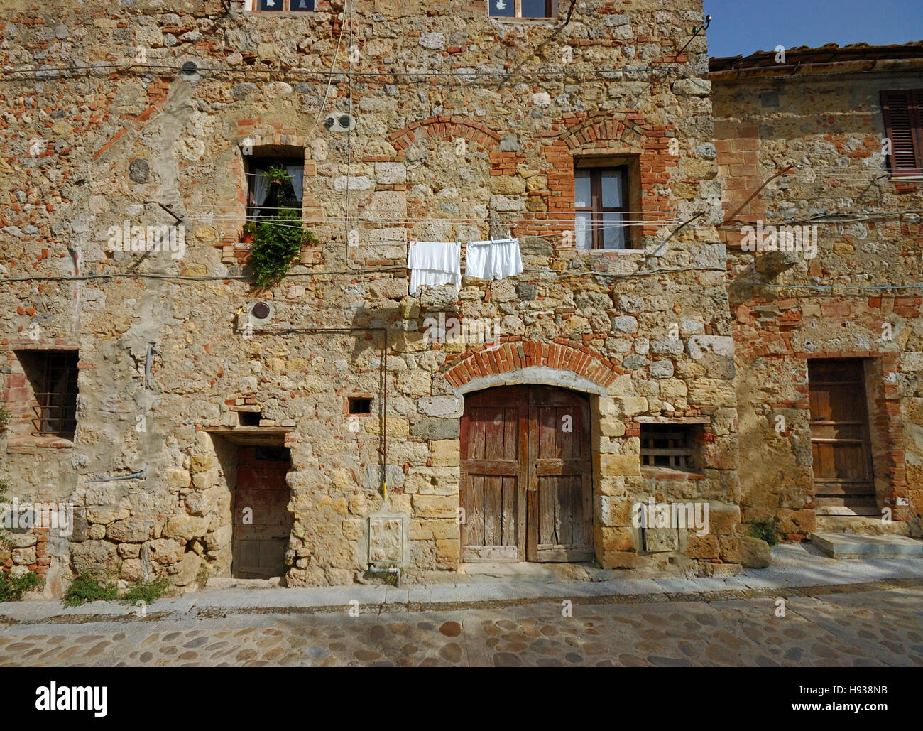 Old stone house on a stone street in the ancient walled town of ...