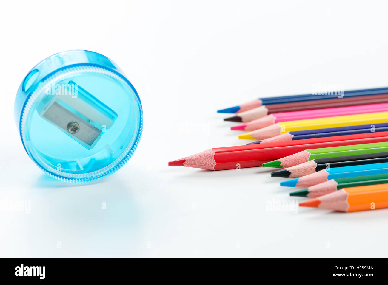 Sharpener and crayons in natural light Stock Photo - Alamy