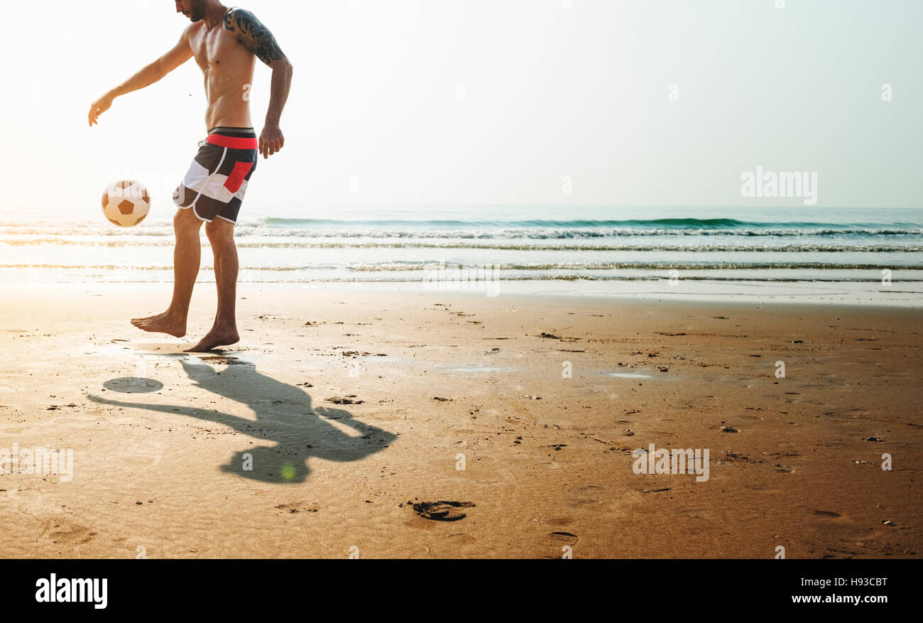 Man Beach Summer Holiday Vacation Football Concept Stock Photo - Alamy