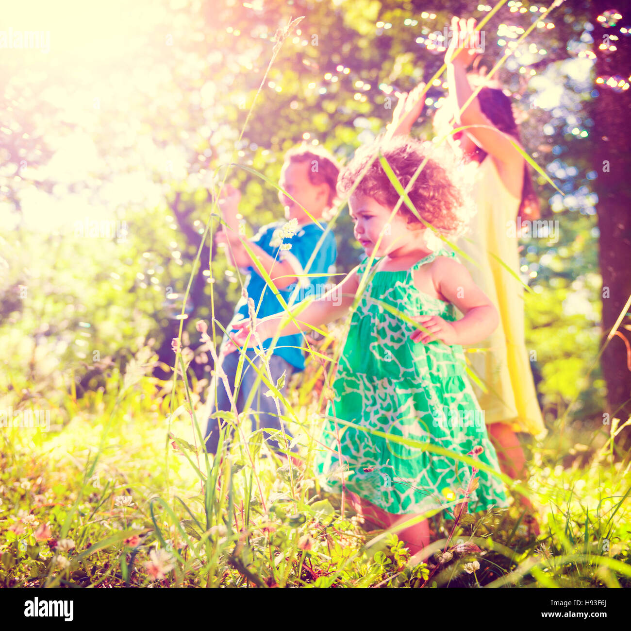 Little Children Playing Together Outdoors Concept Stock Photo - Alamy