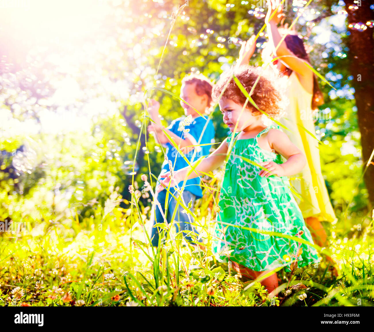 Little Children Playing Together Outdoors Concept Stock Photo - Alamy